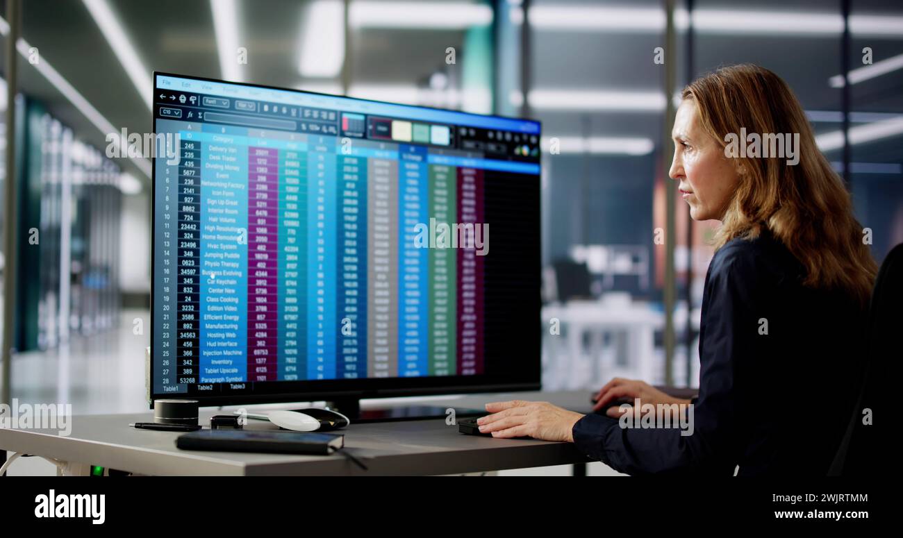 Data Analyst Woman Using Spreadsheet On Computer Stock Photo - Alamy