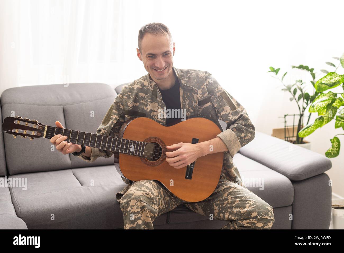 Veteran Guitar Play Concept. Family Meeting. Camouflage Uniform ...