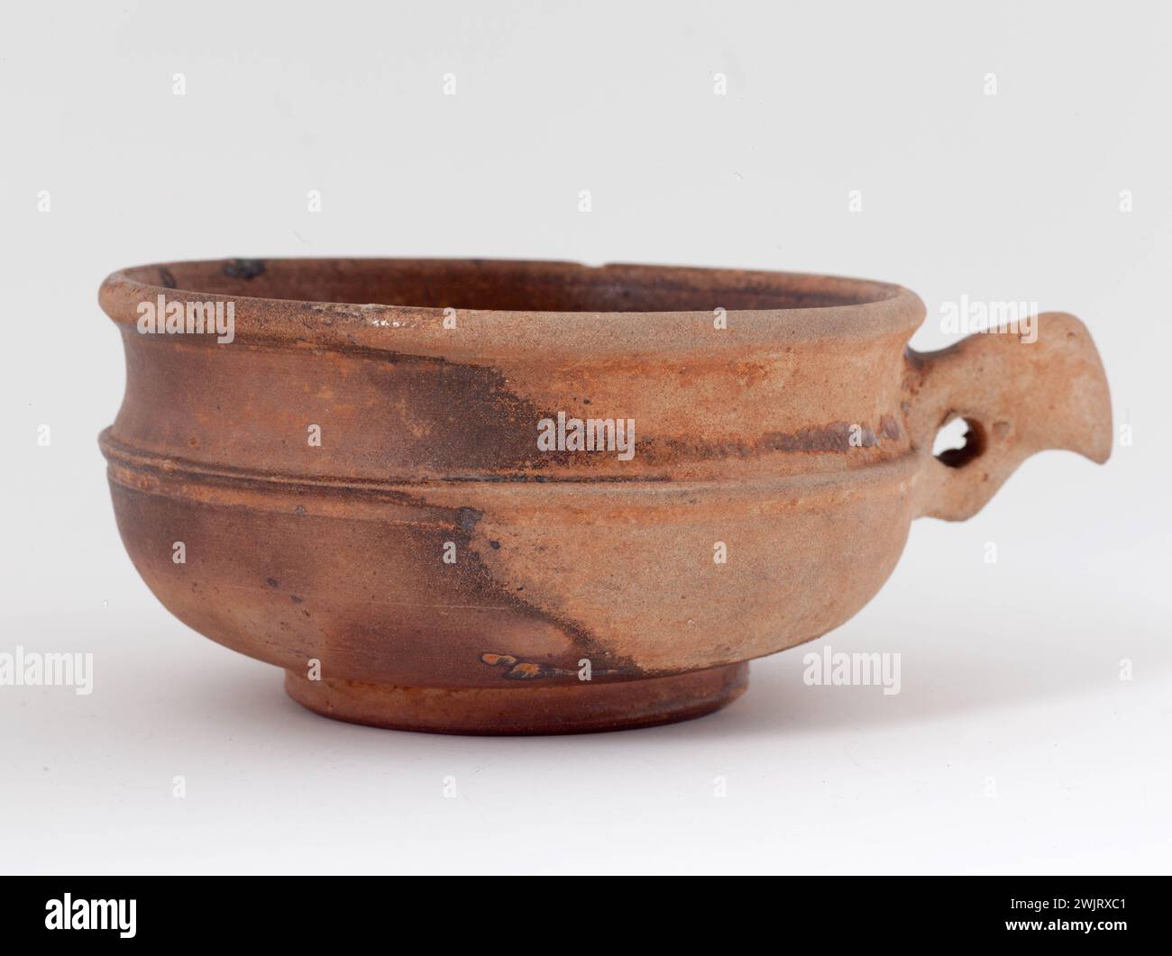 Cup with an erased lounger. Orange terracotta, brown covered. China ...