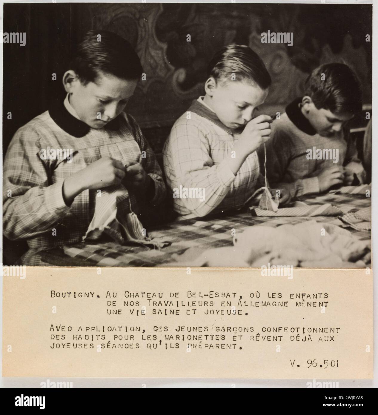 Trampus. "Propaganda photography: young boys making puppet clothes in ...