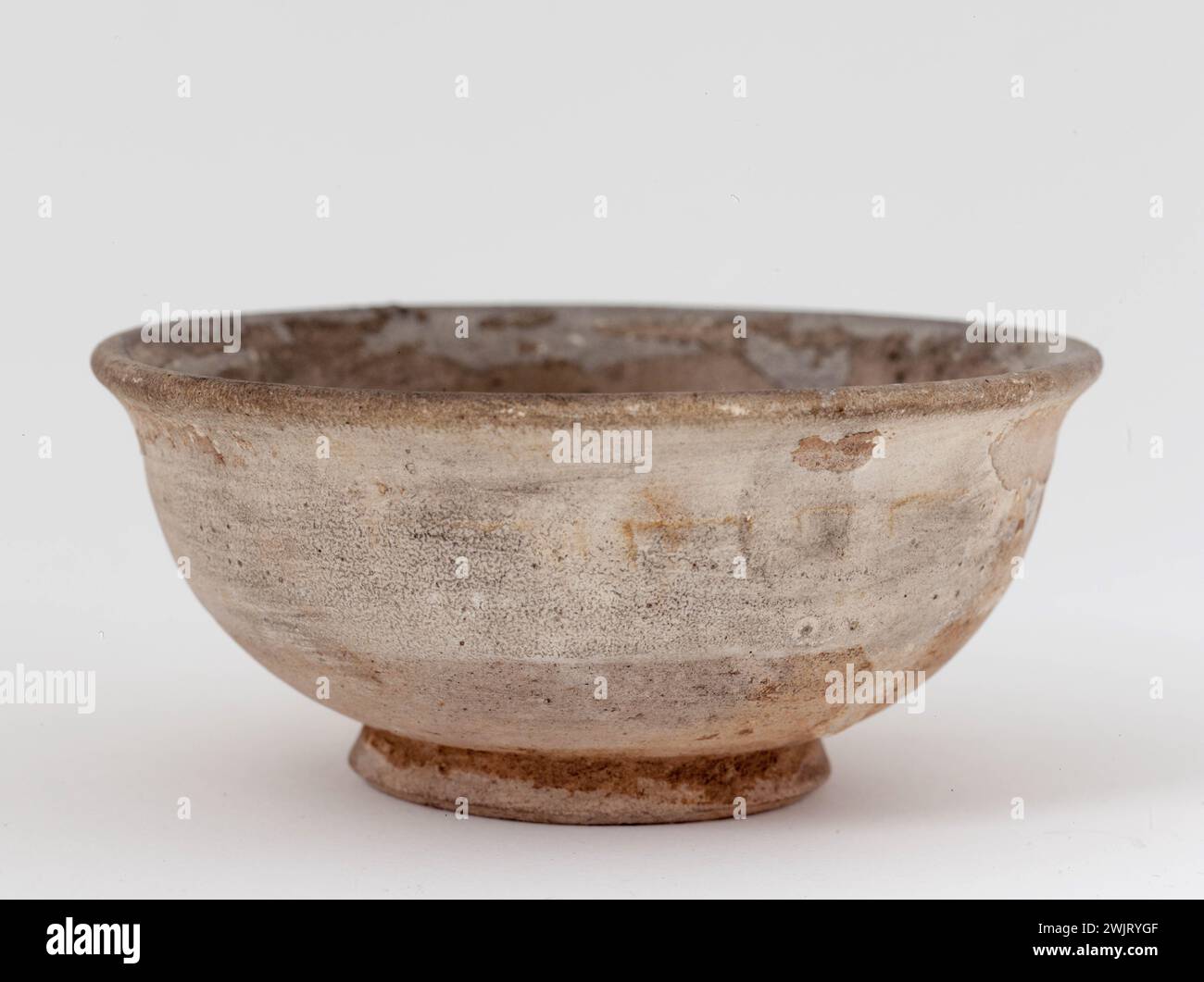 Terracotta cup ". Terracotta, white slip painted with blue and yellow ...