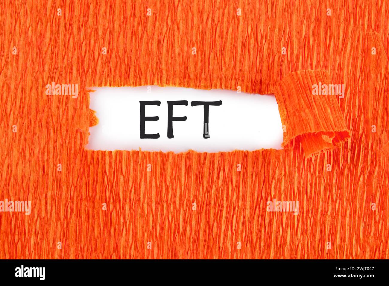 EFT the text under the torn paper is orange on a white background Stock ...
