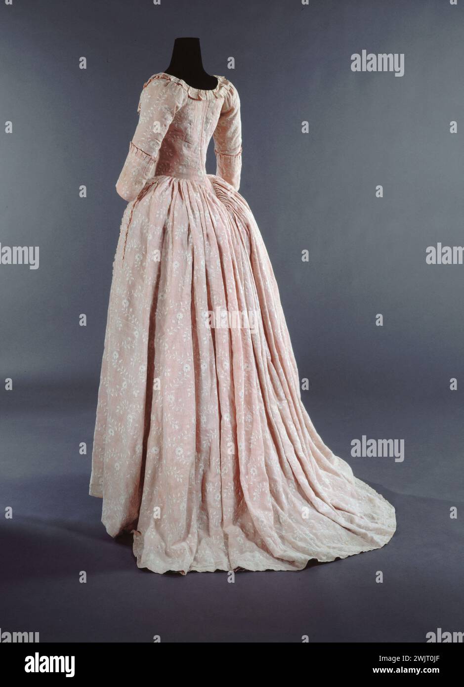 English dress in white cotton muslin embroidered on pink silk taffeta ...