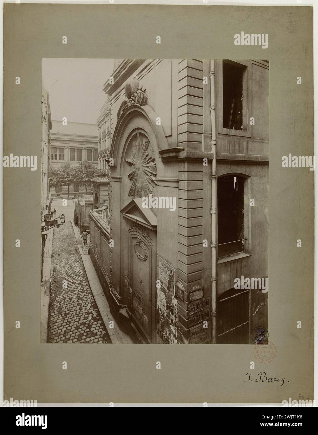 Facade, decorated with a sculpted relief representing a sacred heart ...