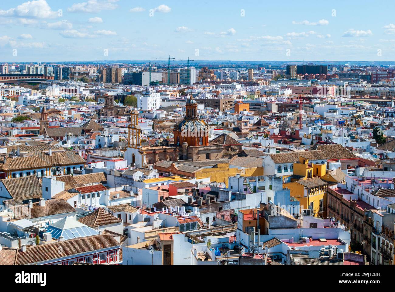 the beautiful blue sky above the roofs of the beautiful Seville ...