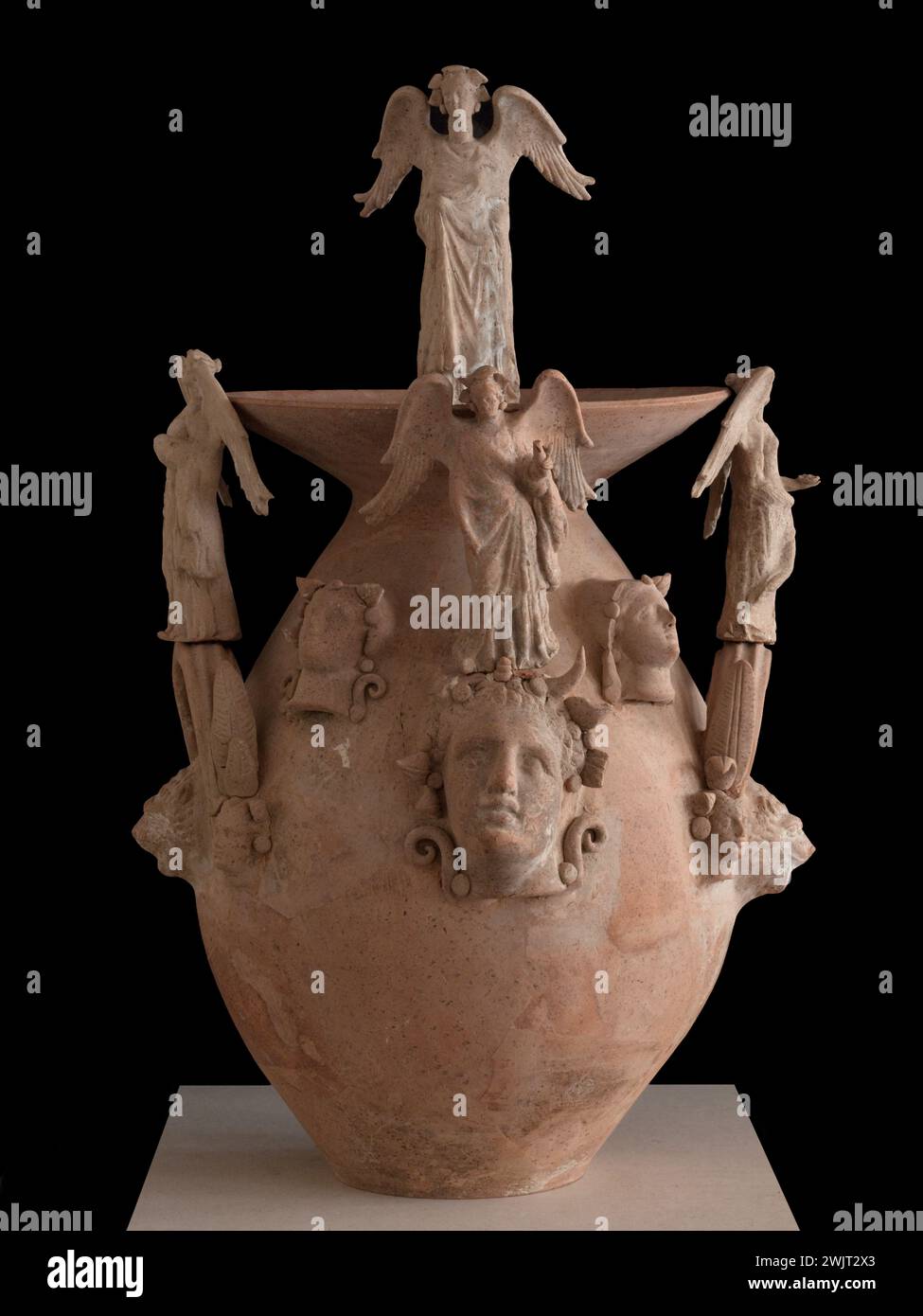 Crater with erect handles (sphageion). Applique decor and statuettes ...
