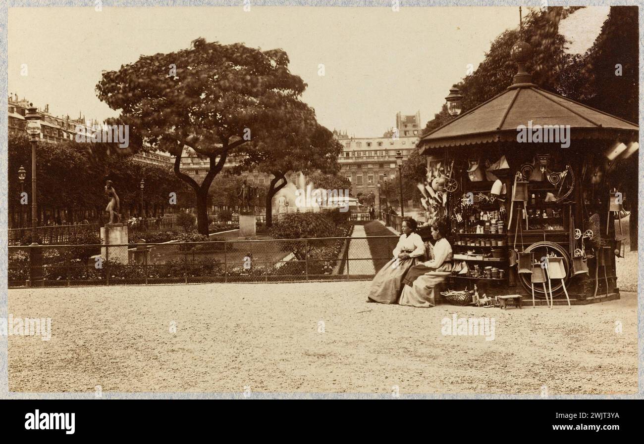 Two women sitting near a kiosk, garden of the Palais-Royal. Paris (1 ...