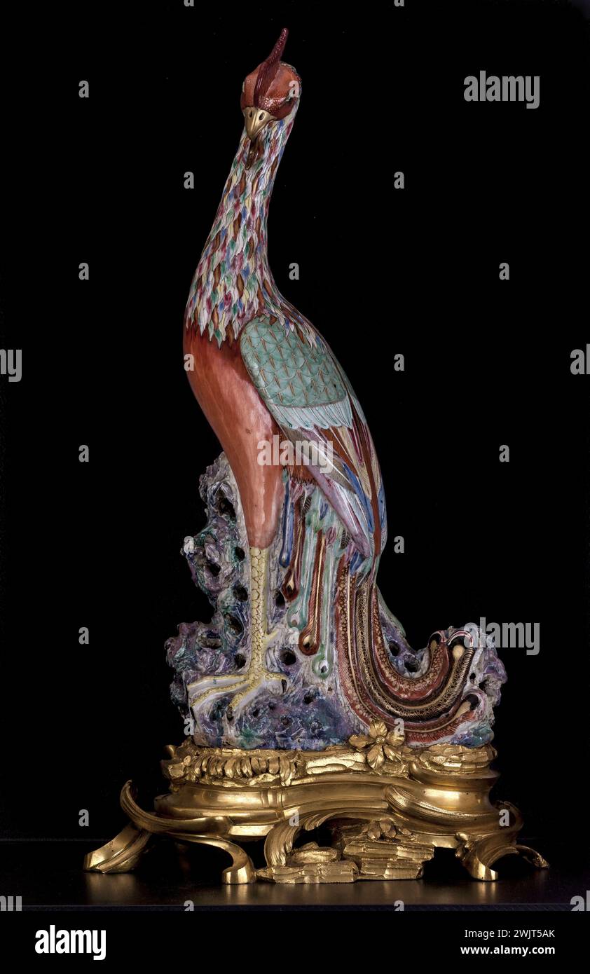 China. Phoenix or Fong Hoang placed on a rock. Porcelain, gilded bronze ...