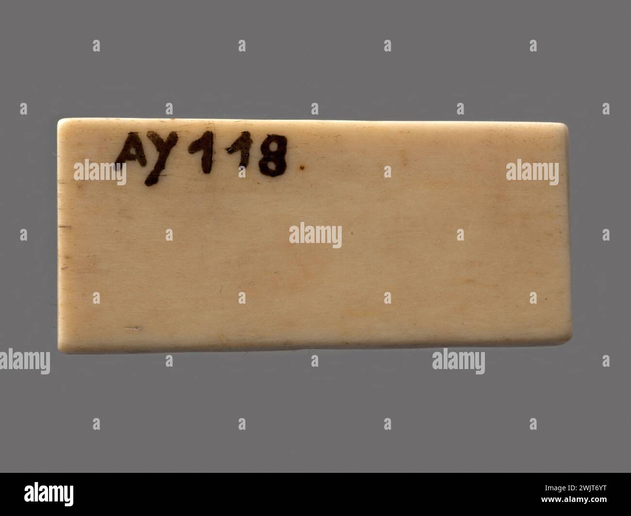 Medieval domino at 1 and 4 points. Cut and polished bone, 1350-1500 ...