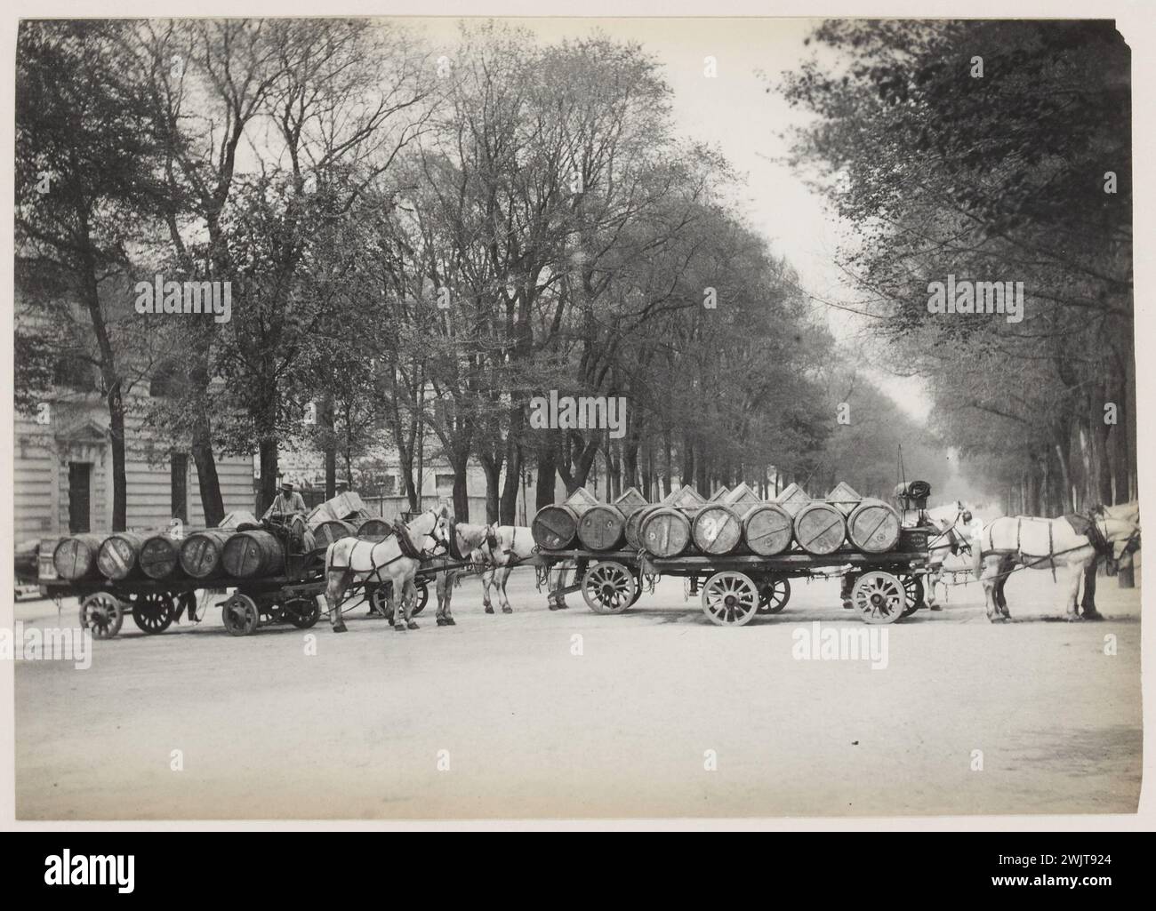 Blancard, Hippolyte (1843 - D.1924), two cars loaded with barrels near ...