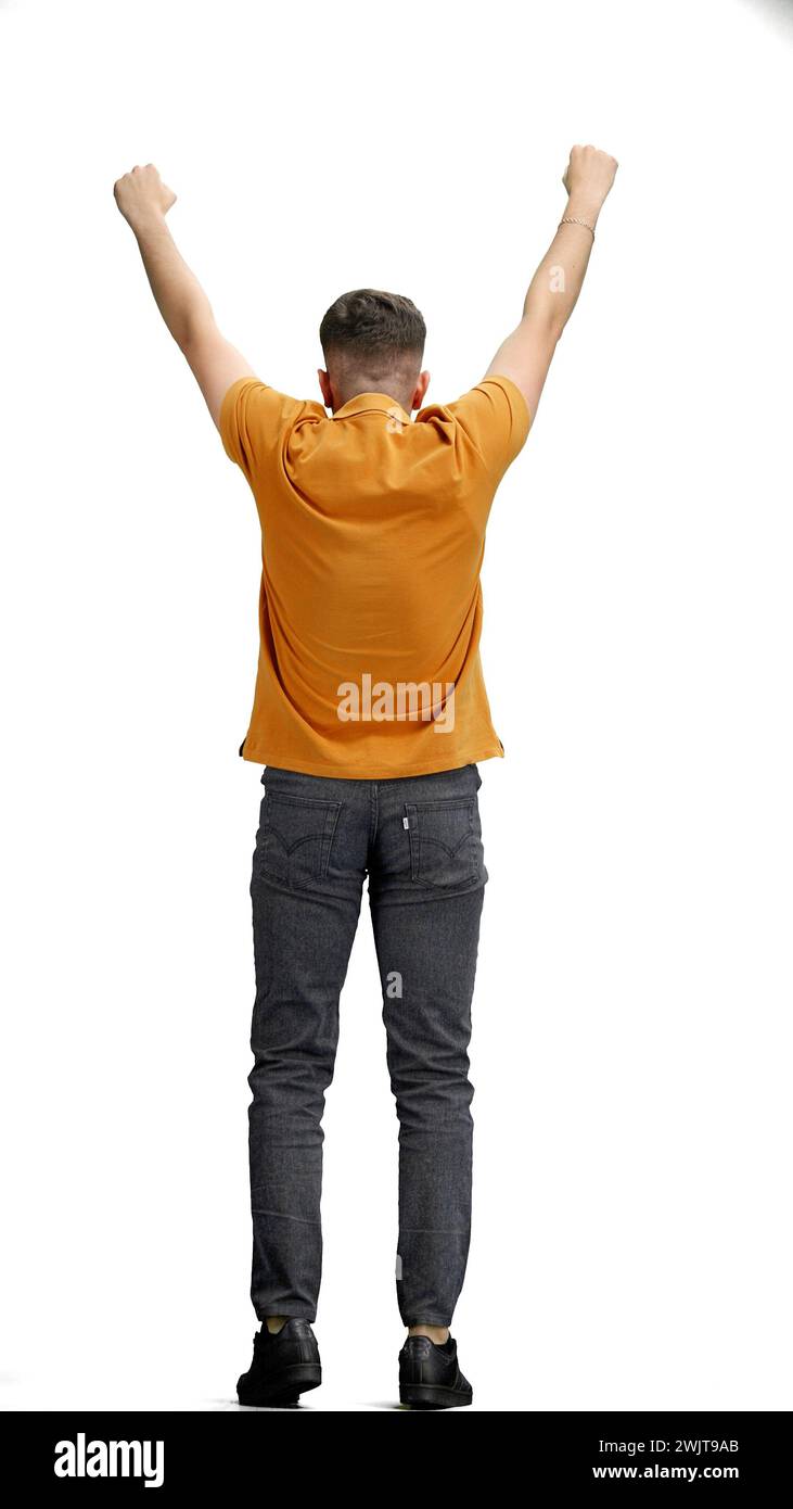 A man, full-length, on a white background, raises his hands up Stock ...