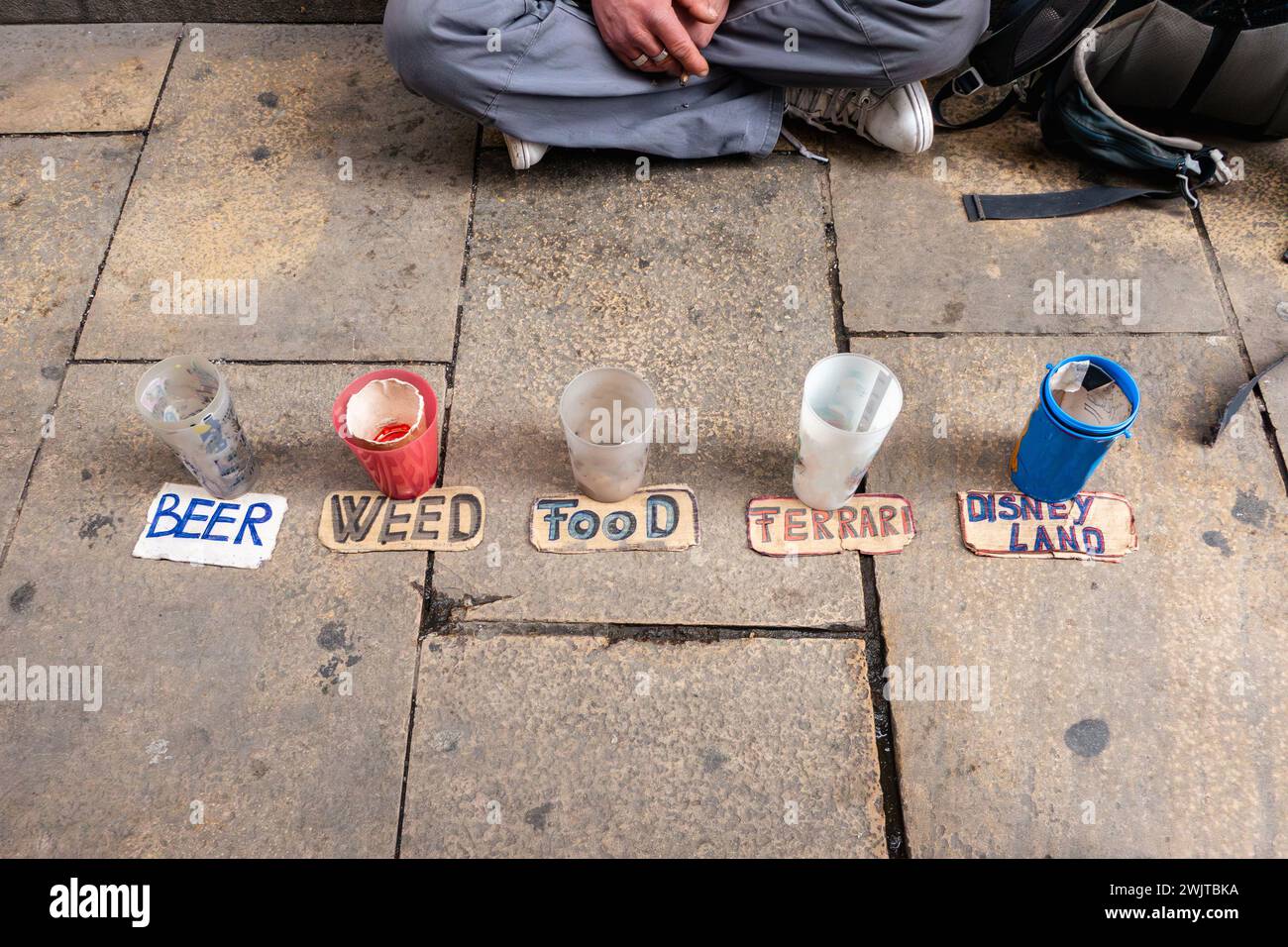 Homeless lifestyle. beggar man begging alms for food, beer, weed ...