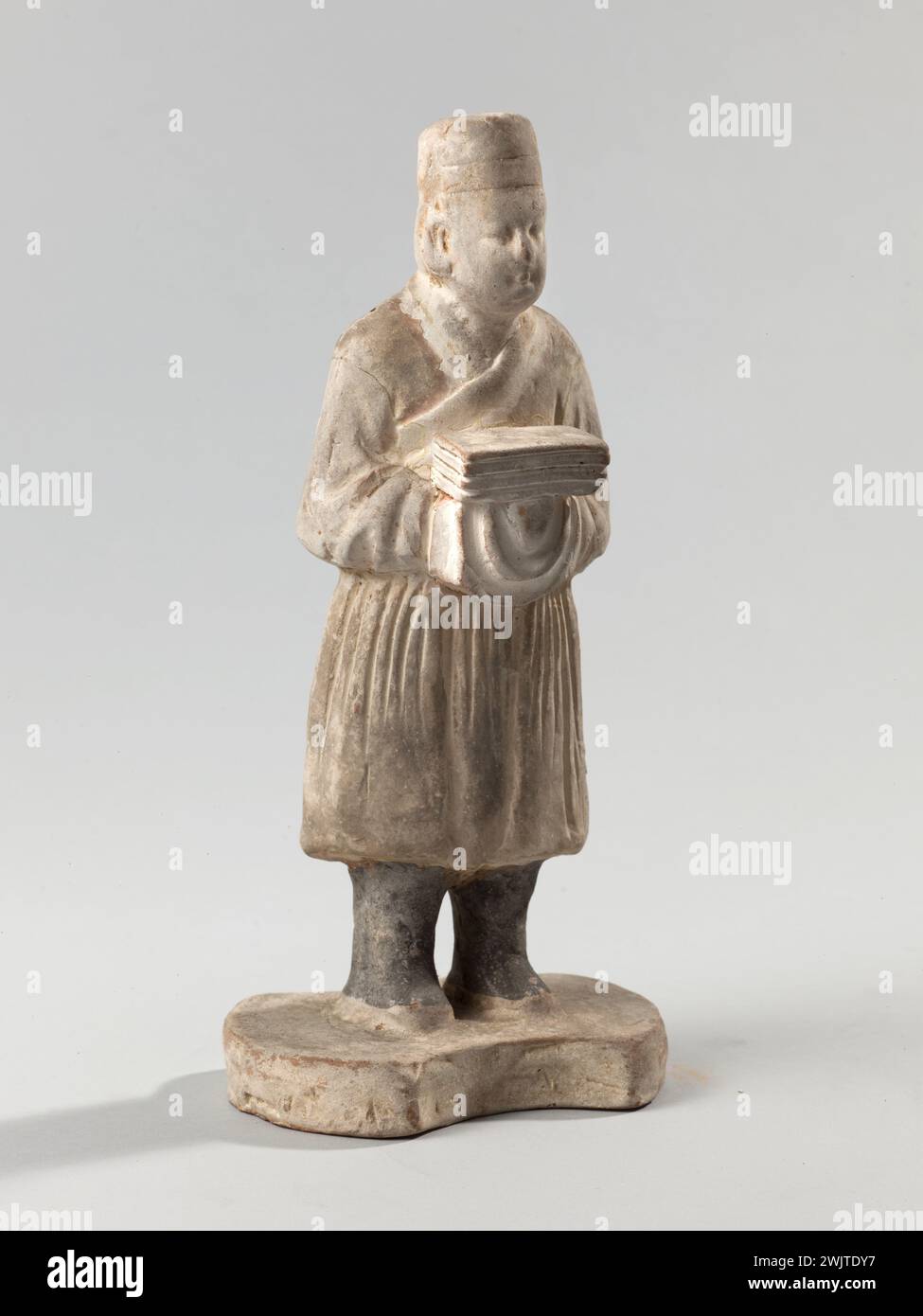 Male character mingqi. Terracotta, brown glaze, traces of polychromy ...