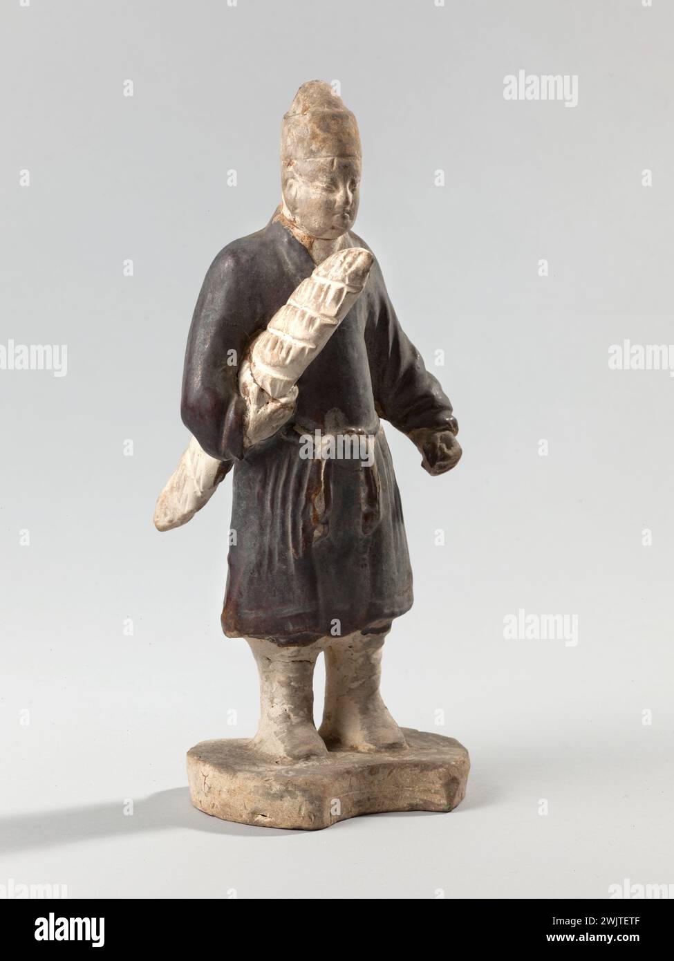 Male character mingqi. Terracotta, brown glaze, traces of polychromy ...