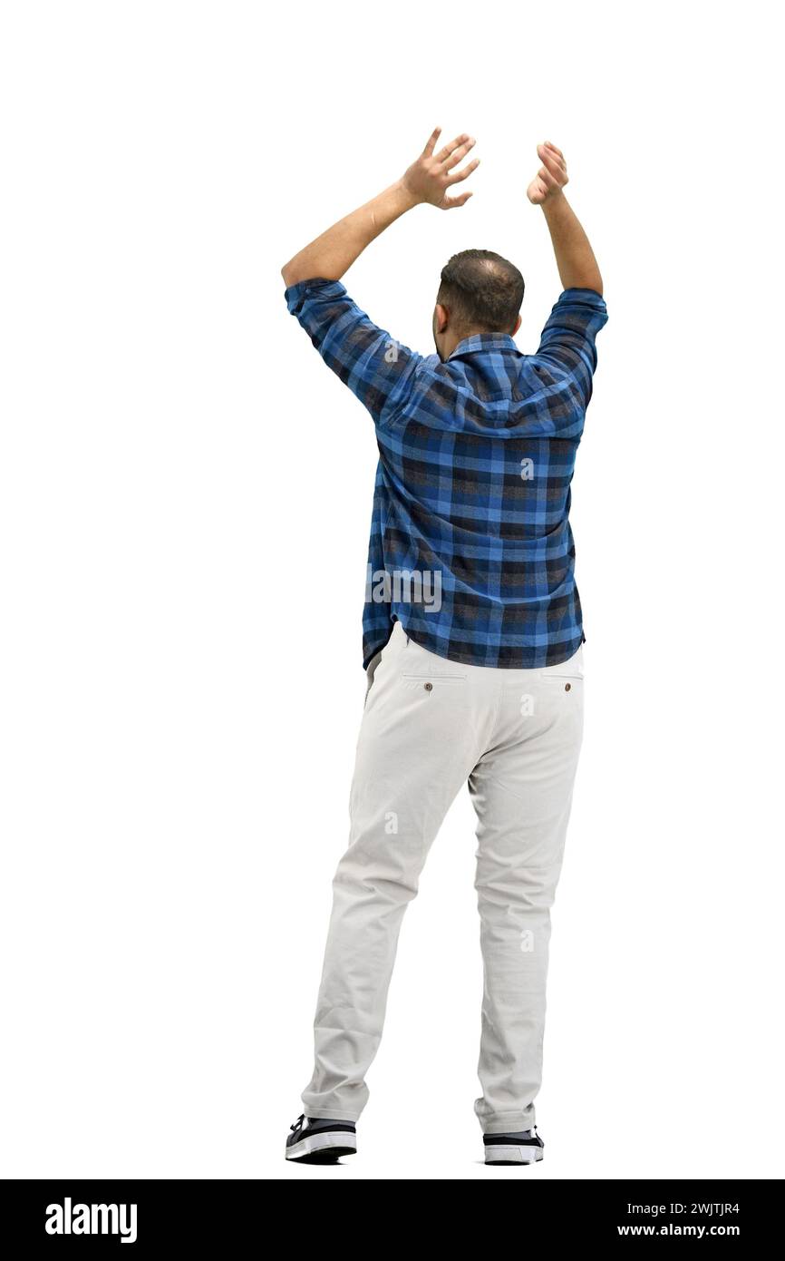 A man, full-length, on a white background, raised his hands up Stock ...