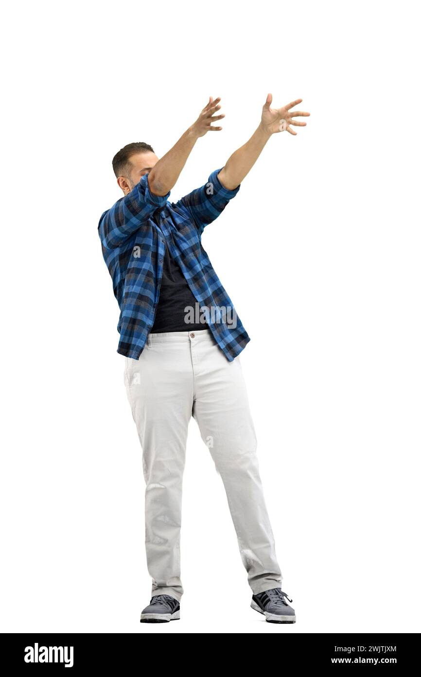 A man, full-length, on a white background, raised his hands up Stock ...