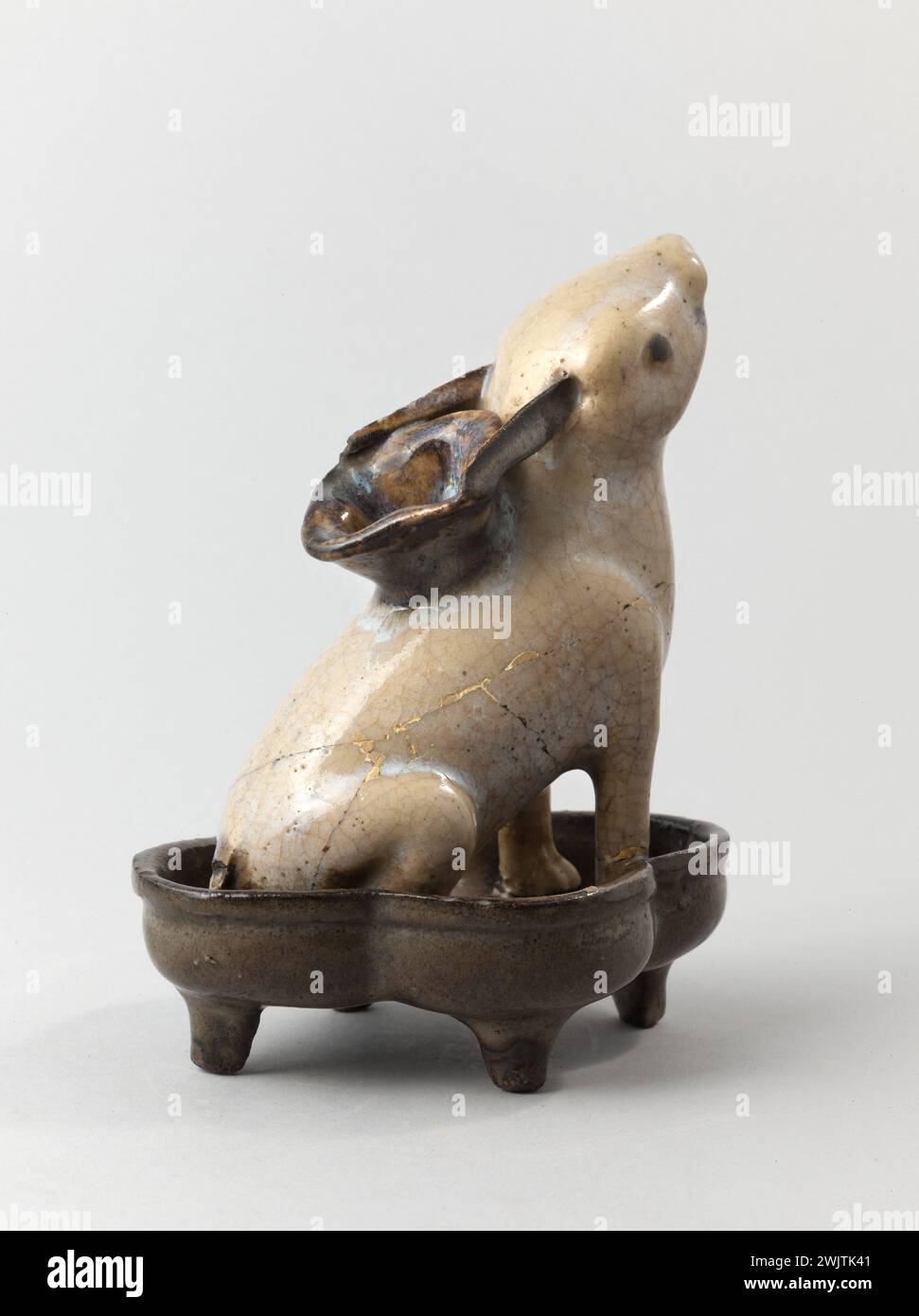 Rabbit. Sandstone with broken white enamel with bluish reflections ...