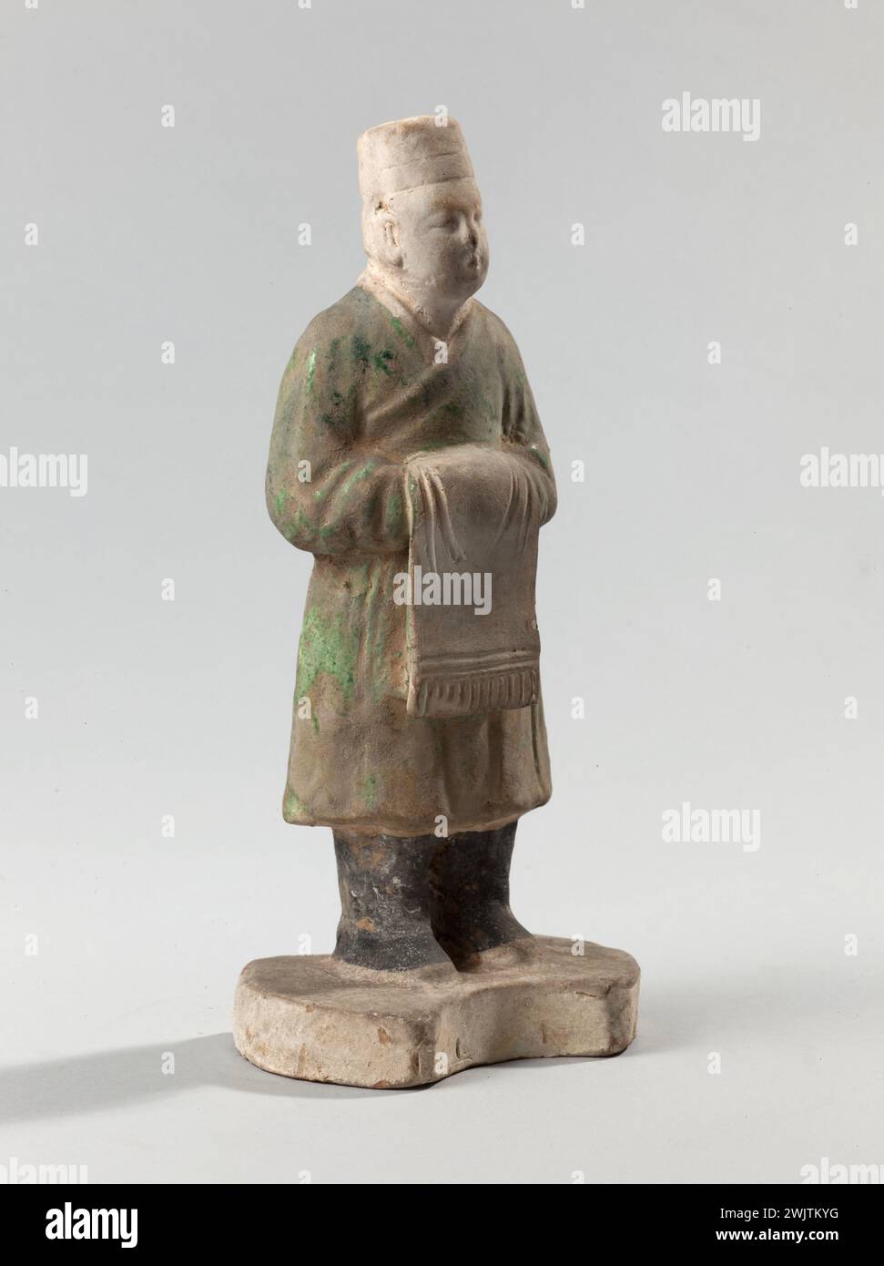Male character mingqi. Terracotta ; Traces of green glaze and dark ...