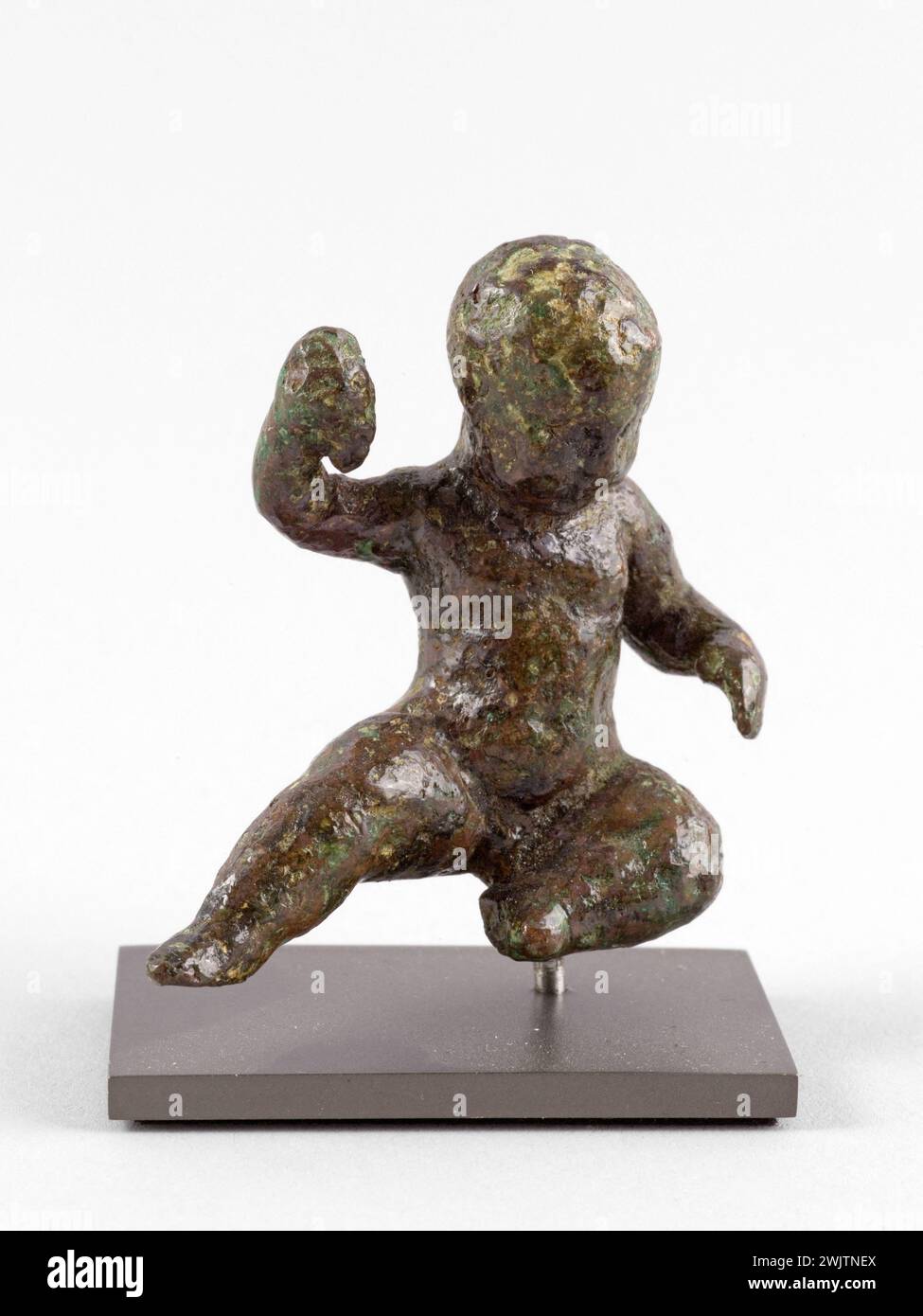 Child statuette with grape bunch. Copper alloy. Gallo-Roman time. Paris ...