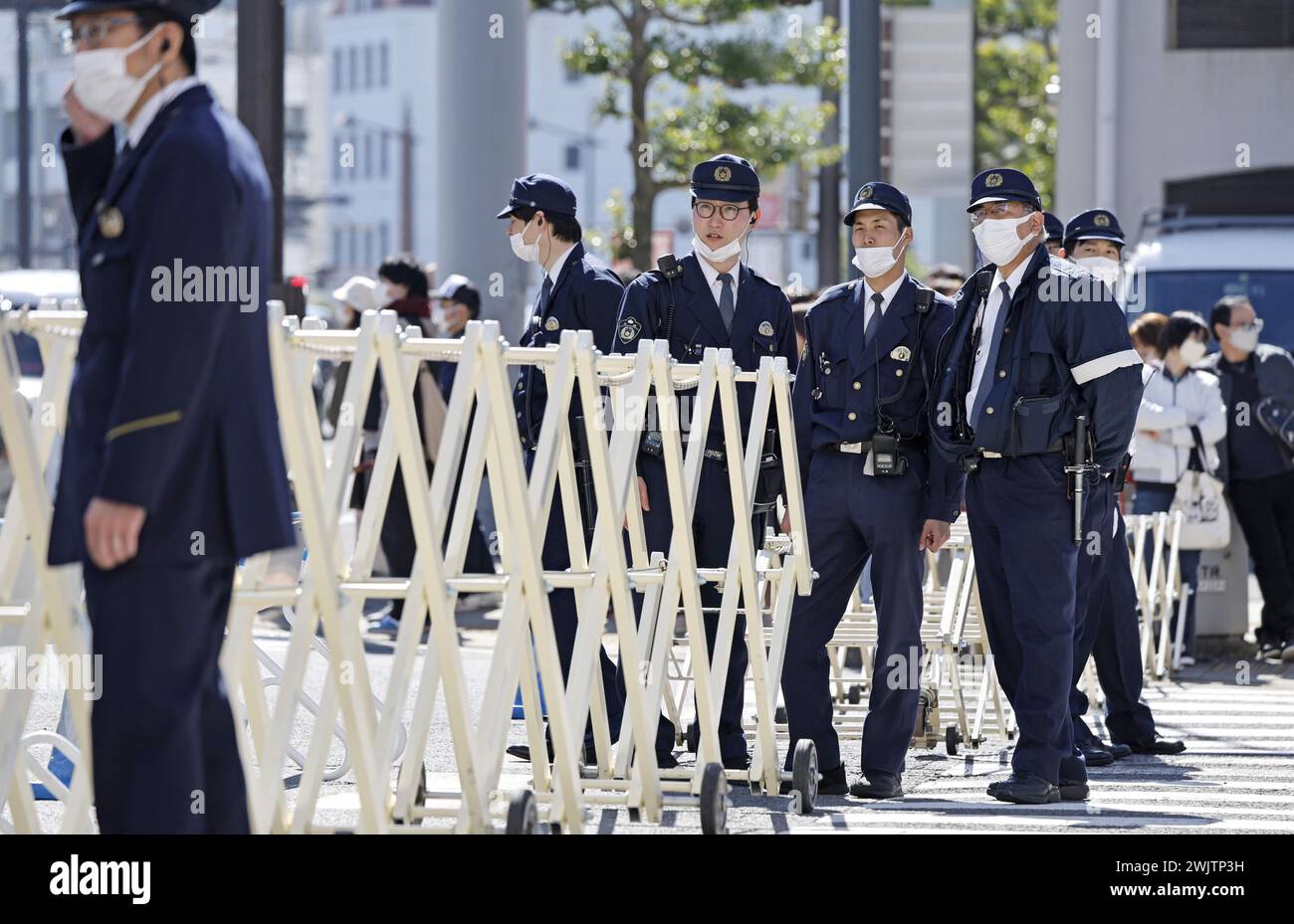 Police officers manage traffic during a Nagasaki lantern festival ...
