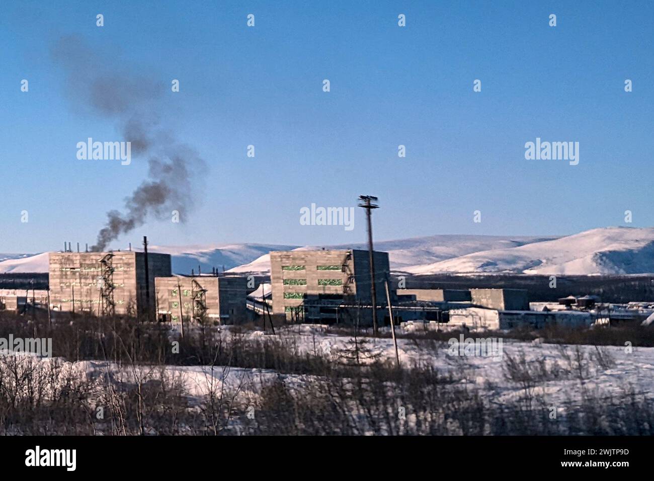 Smoke rises from a building in the town of Kharp, in the Yamalo-Nenetsk ...