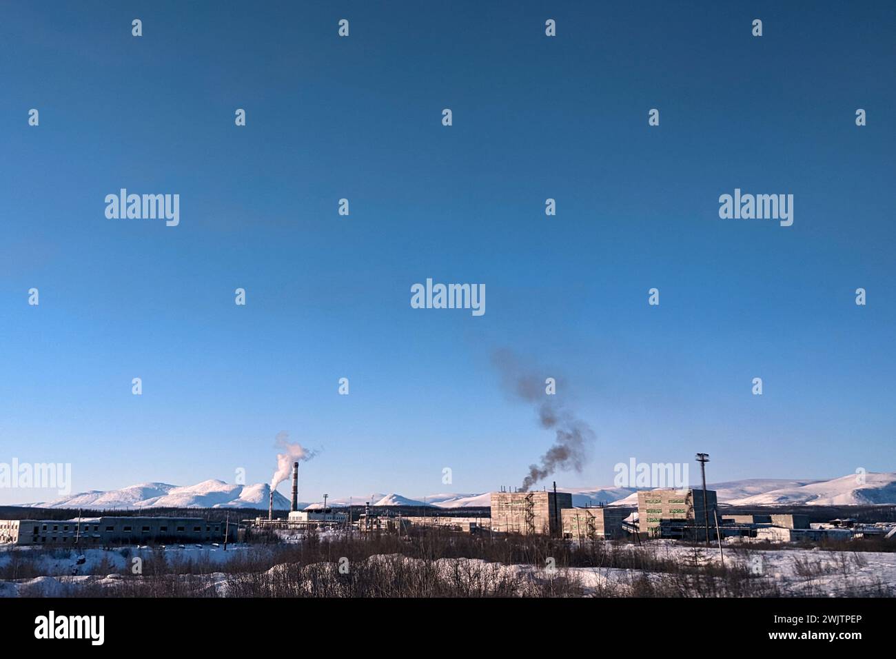 Smoke rises from a building in the town of Kharp, in the Yamalo-Nenetsk ...