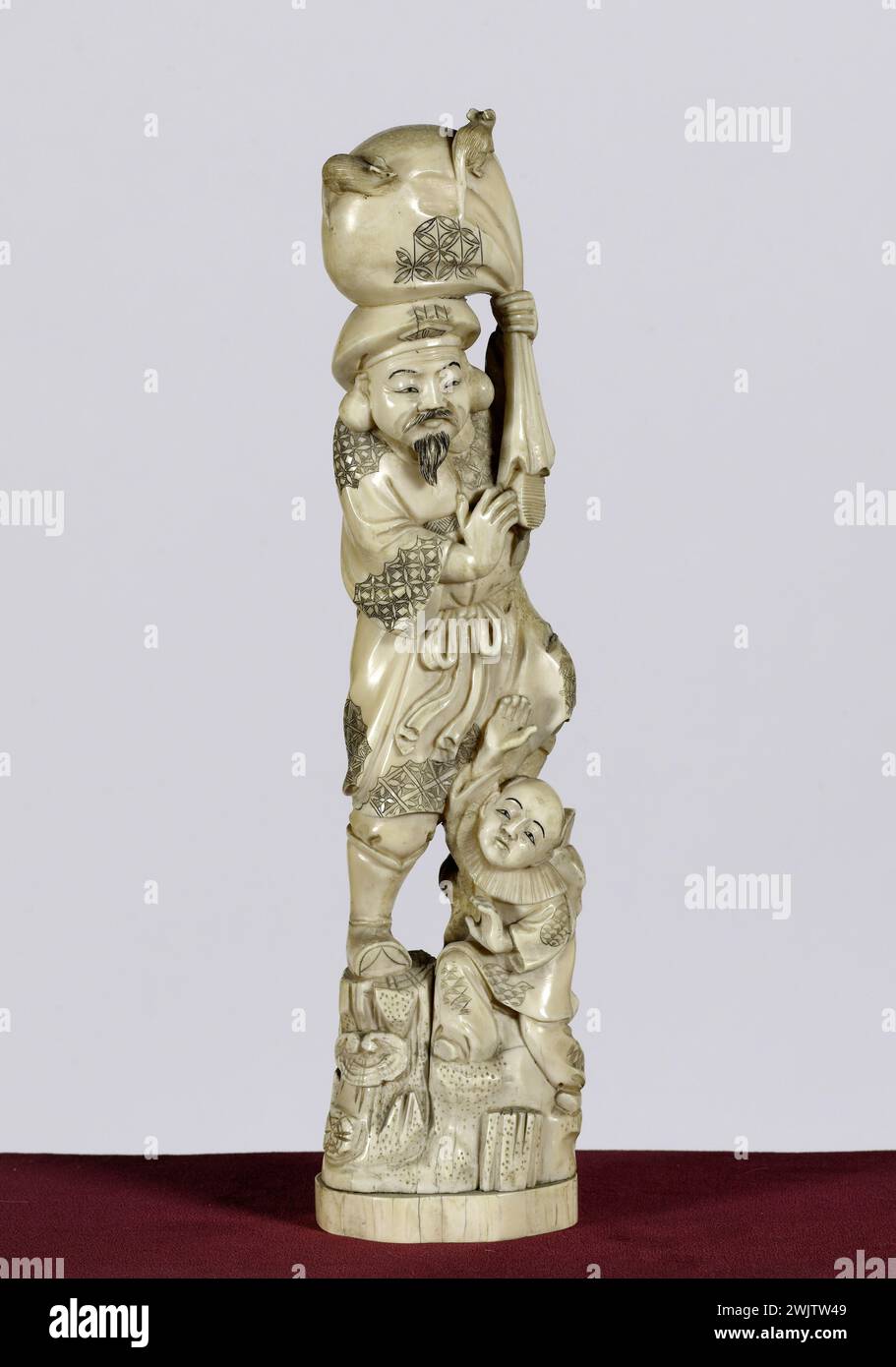 Chinese living room, Asian art work, south wall. "Merchant with a bag ...