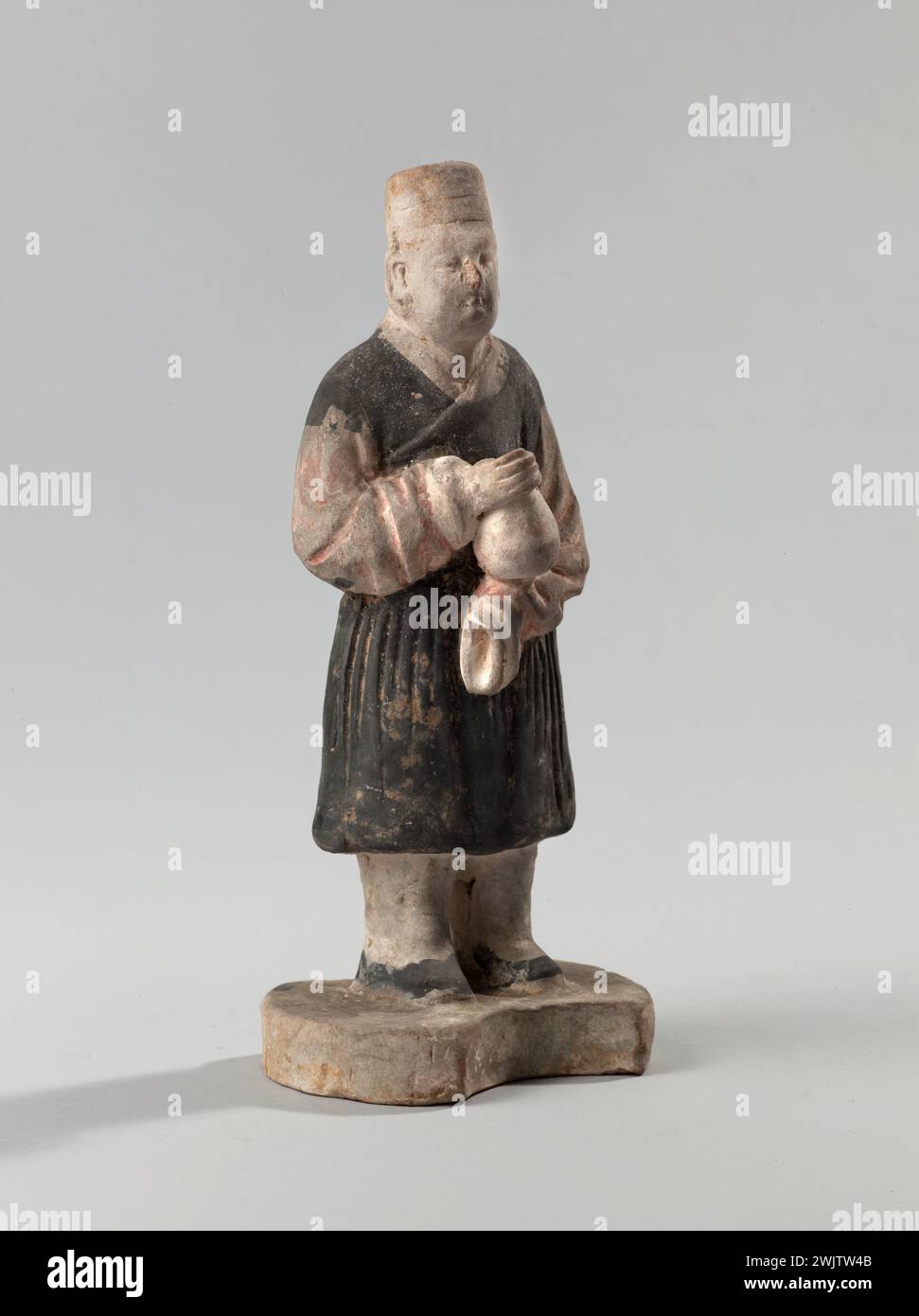 Male character mingqi. Terracotta, brown glaze, traces of polychromy ...