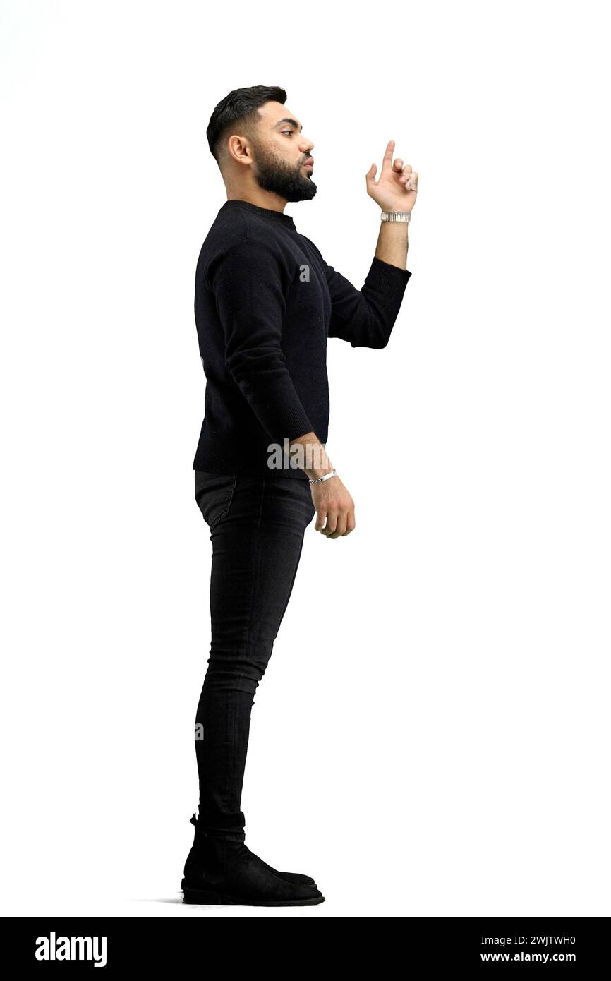 A man, in full height, on a white background, points to the side Stock ...