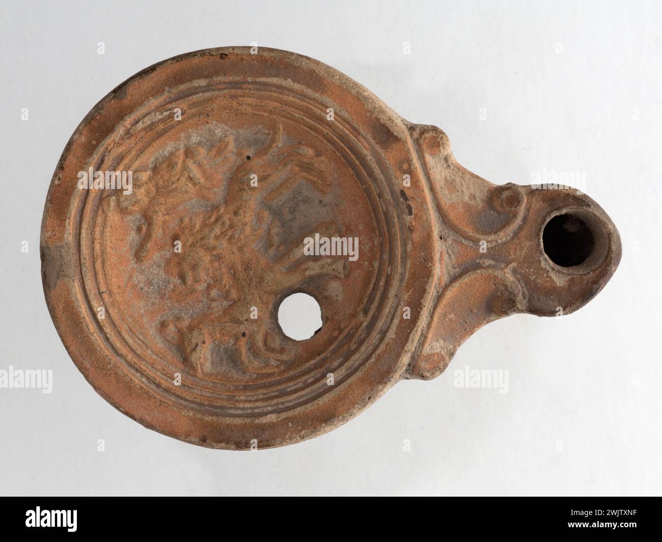 Oil lamp. Hunting scene, scroll beak. Terracotta. High Empire. Paris ...