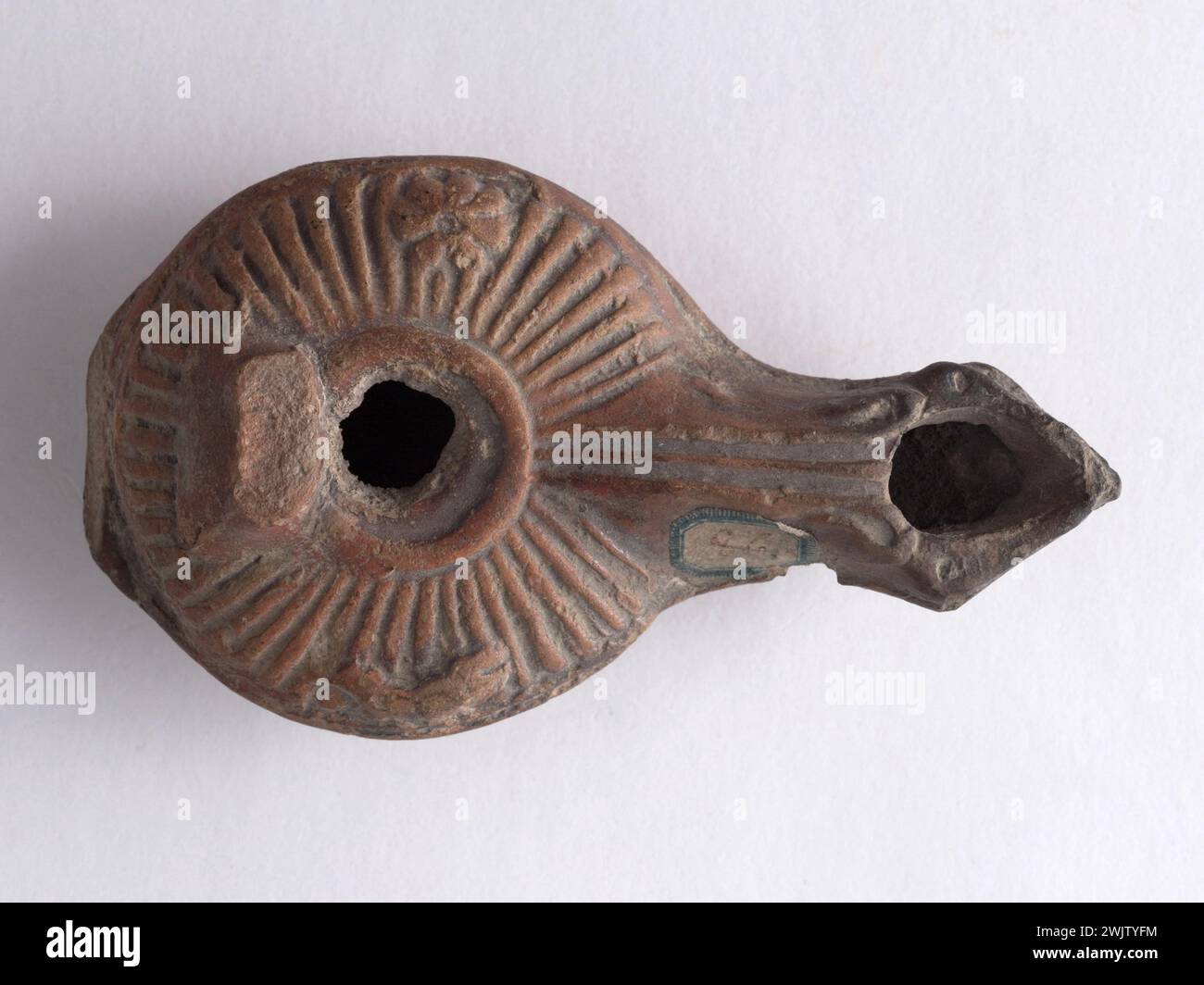 Oil lamp. Terracotta. High Empire. Lying beak, flower and animal on ...