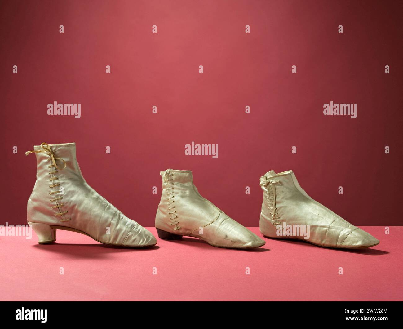 Set of three lactful boots, in cream satin, marking the evolution of ...