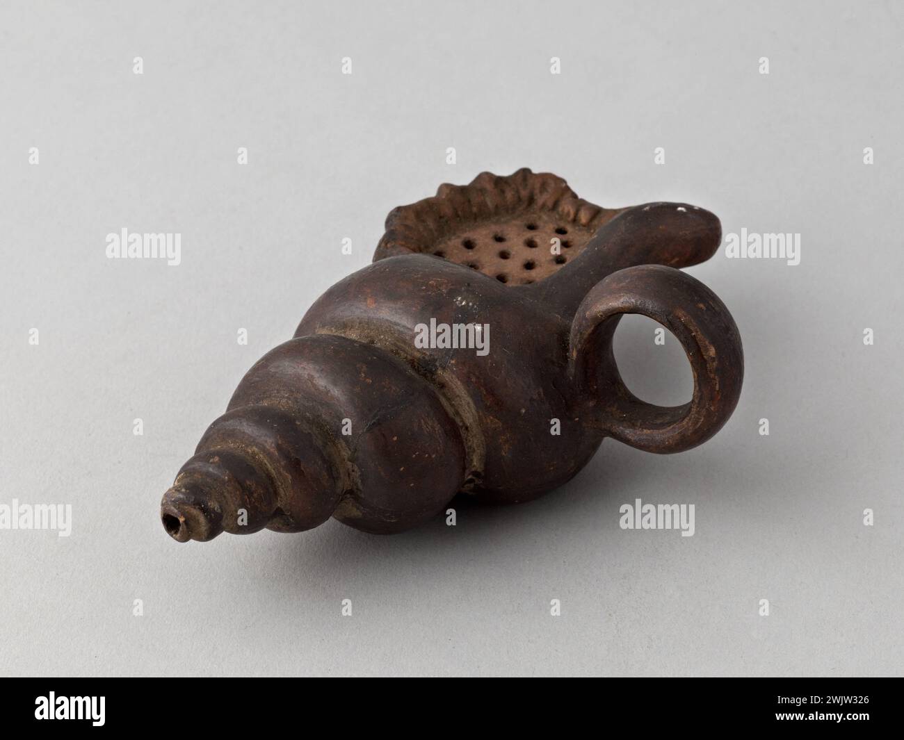 Guttus in the shape of a murex shell. Molded terracotta. Apulie (Italy ...