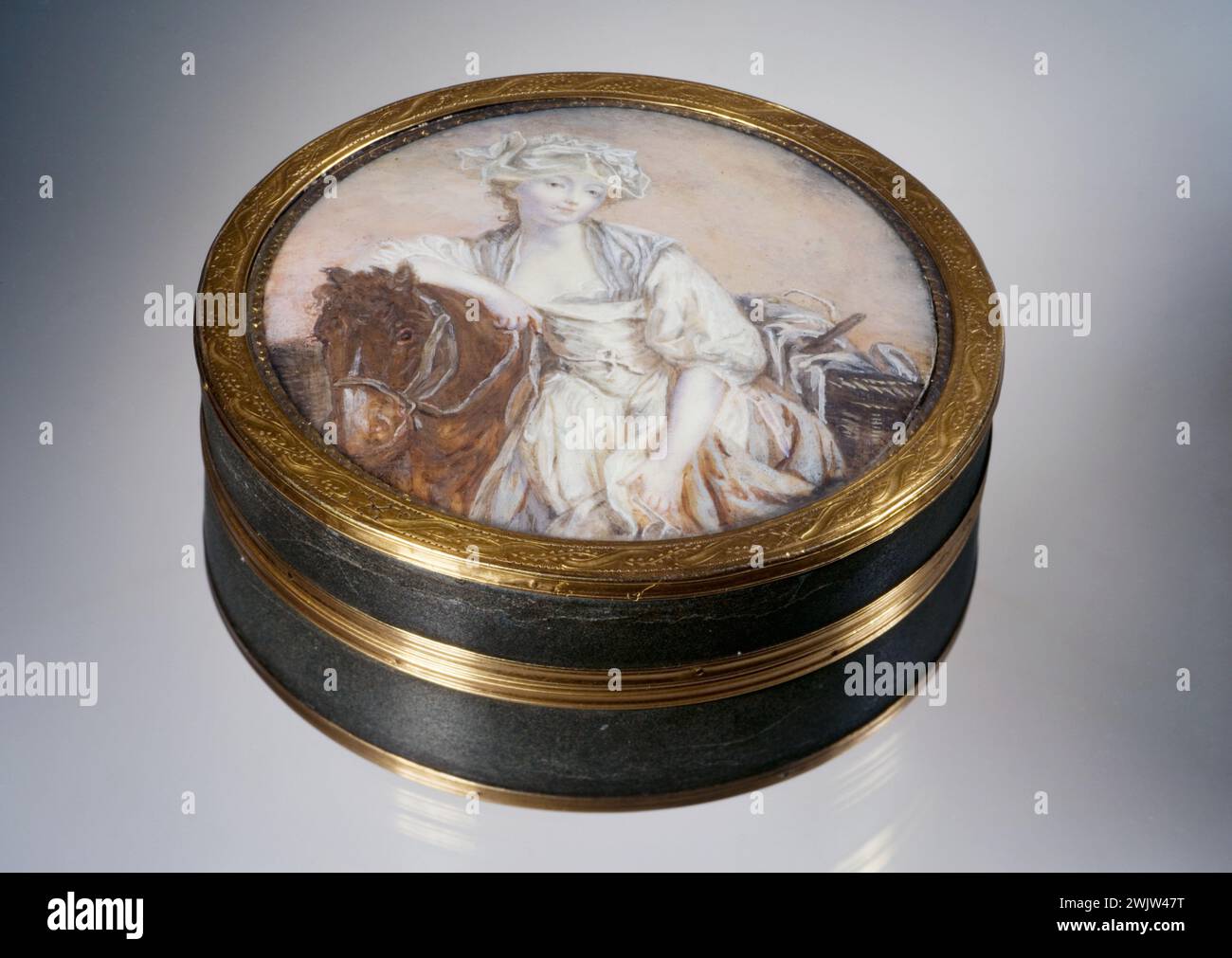 Circular box in bluish composite material, circulated by gold and lined ...