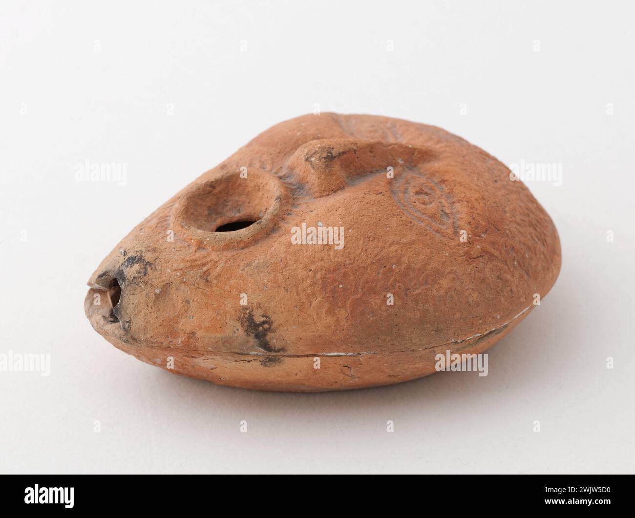 Lamp. Coll. Capitan. Terracotta. High Empire. In the shape of a human ...