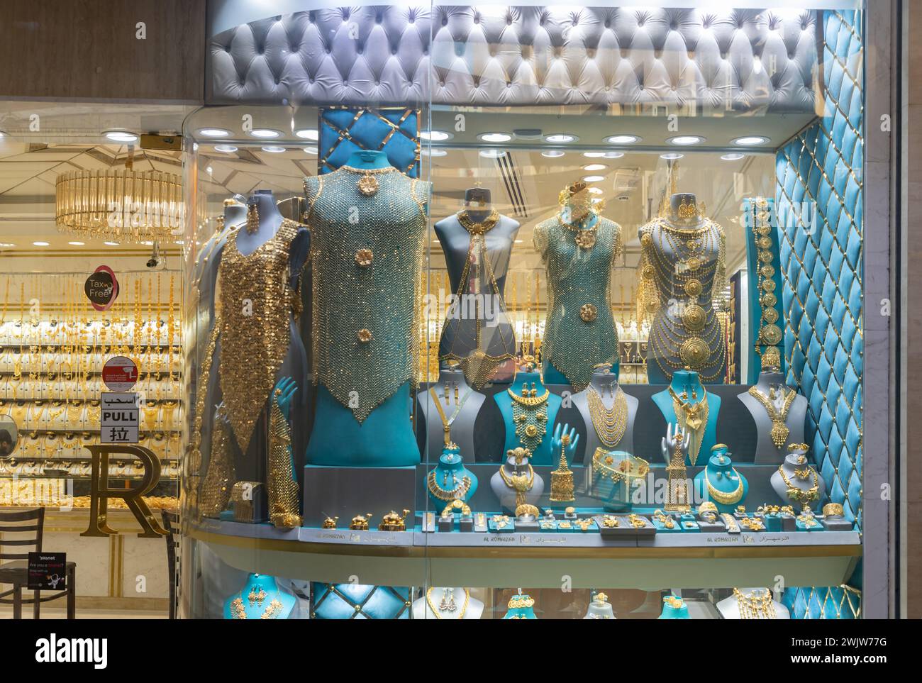 A picture of women's jewelry on a storefront at the Dubai Gold Souk ...