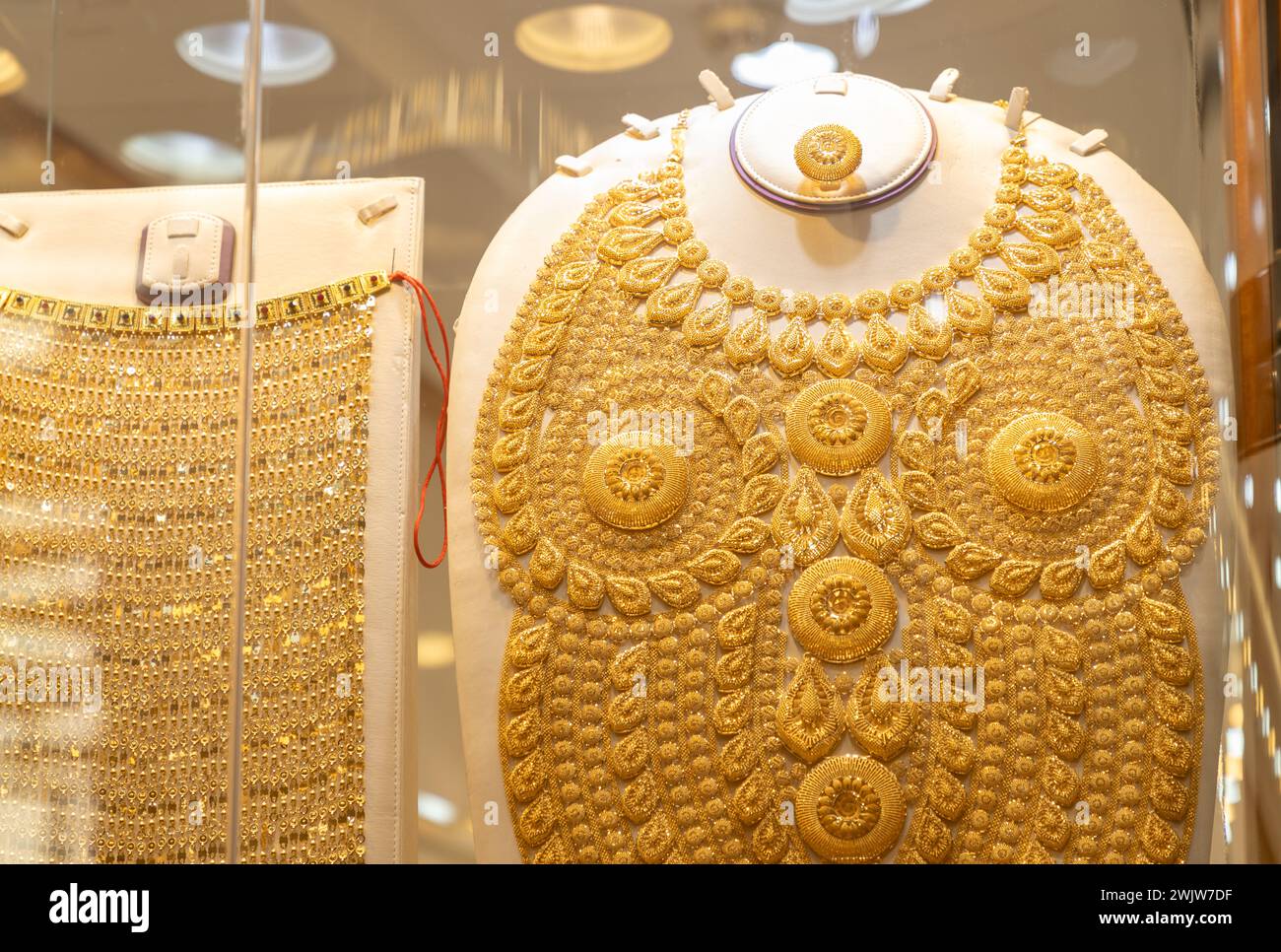 A picture of women's jewelry on a storefront at the Dubai Gold Souk ...