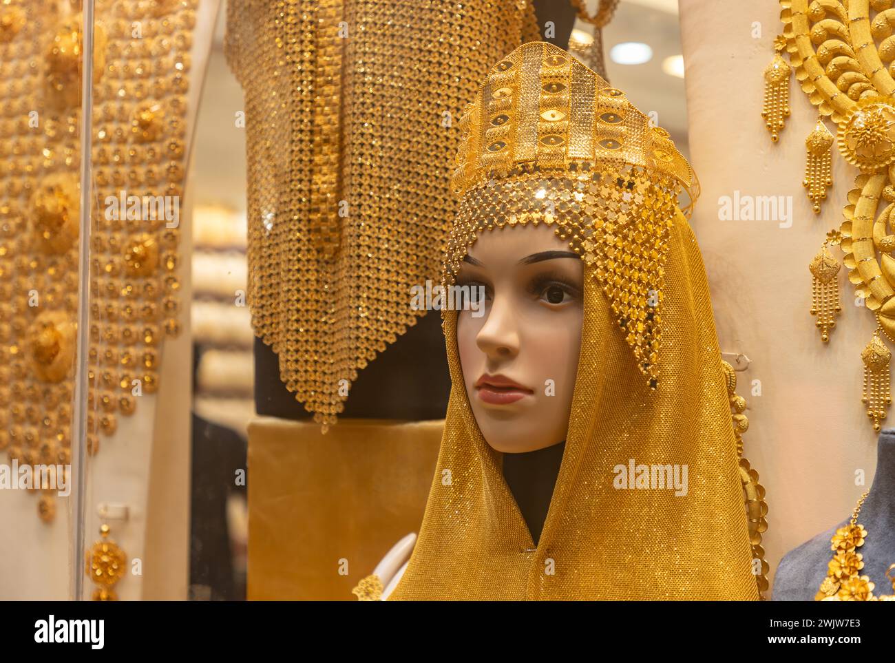 A picture of women's jewelry on a storefront at the Dubai Gold Souk ...