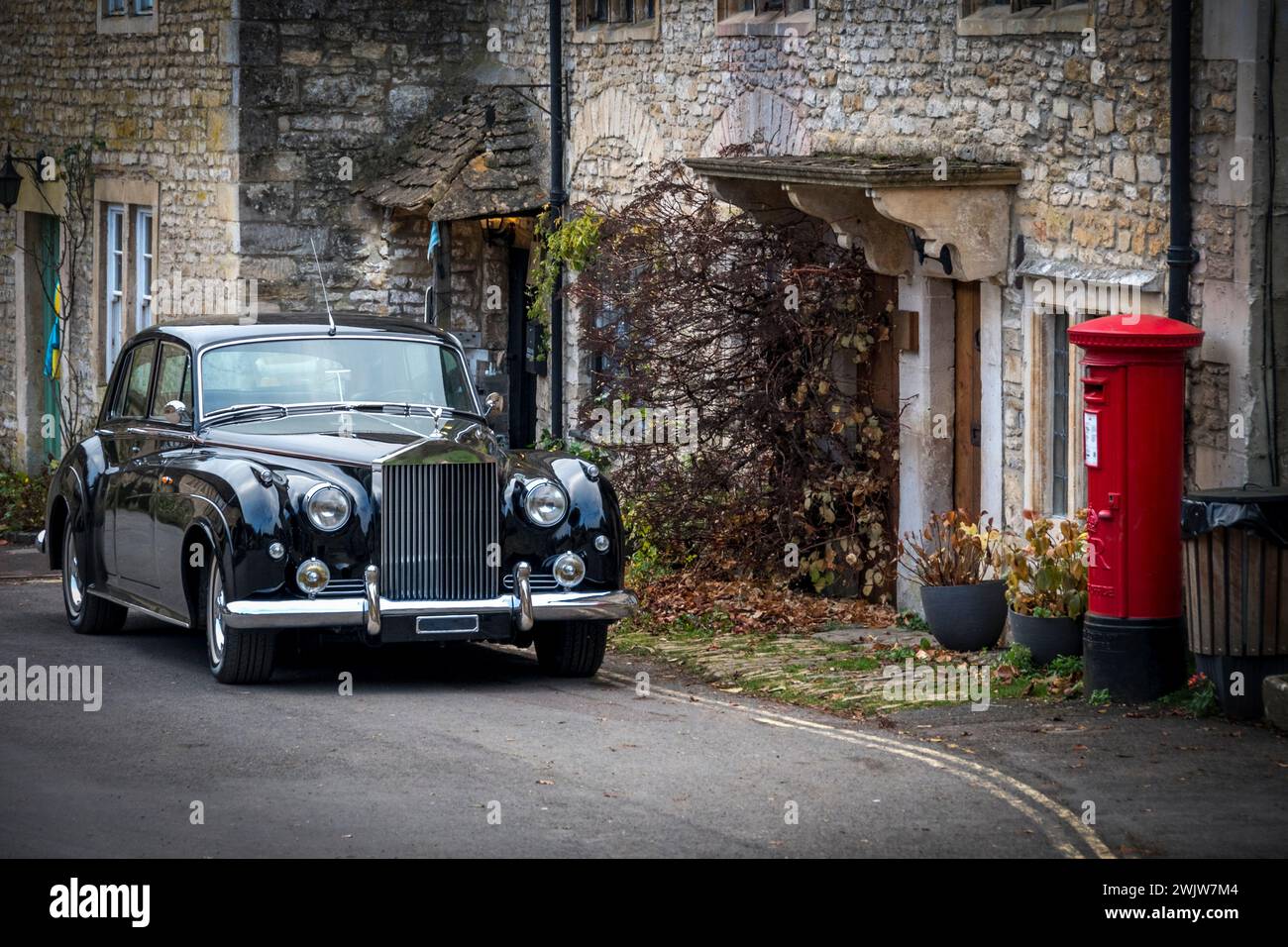 Castle Coombe, a pretty village in Wiltshire, which has many visitors ...