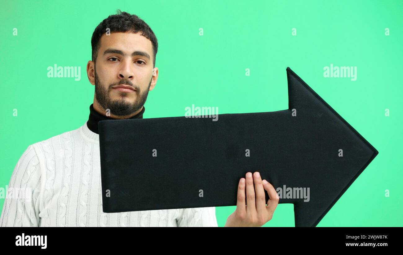 Happy black guy holding arrow hi-res stock photography and images - Alamy