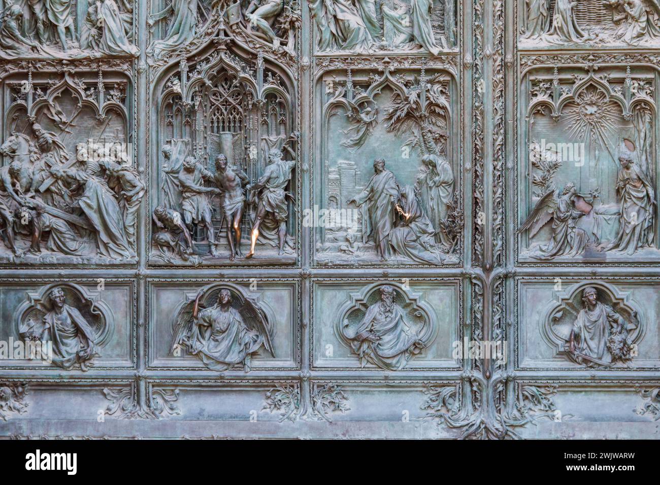 Detail of a bronze door of Milan cathedral, Italy Stock Photo - Alamy