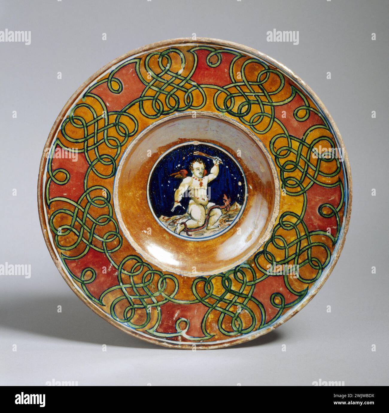 Plate: love fighting a snake, Italian majolica of Gubbio, between 1520 ...