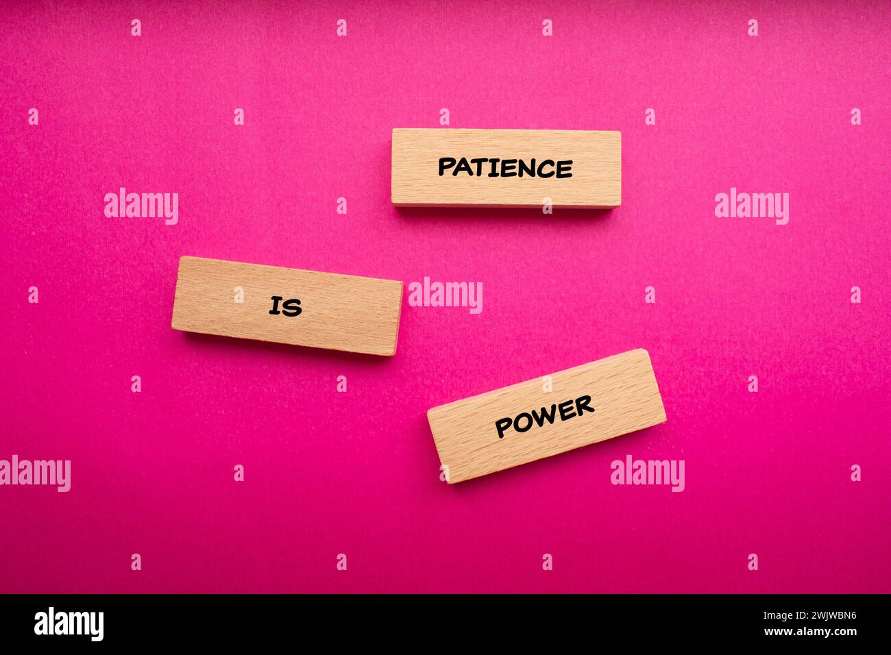 Patience is power words written on wooden blocks with pink background ...