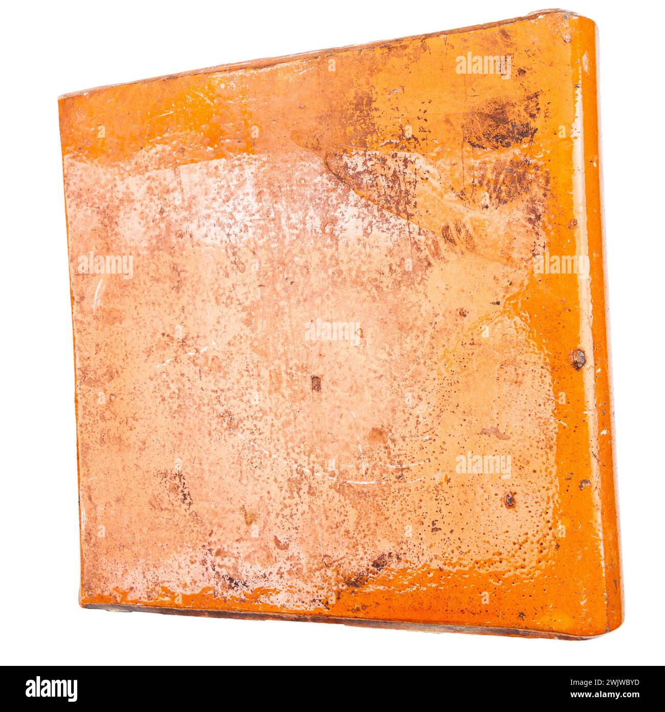 Old orange glazed furnace tile isolated on white background Stock Photo ...