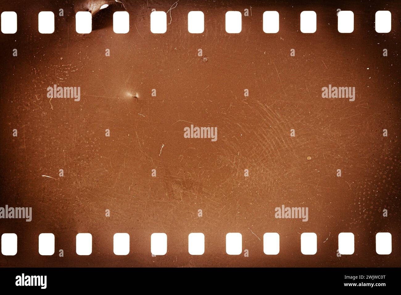 Dusty and grungy 35mm film texture or surface. Perforated scratched ...