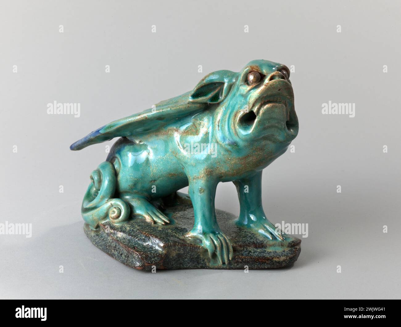 Fantastic animal. Mythical animal resembling a bat on a base; Broken ...