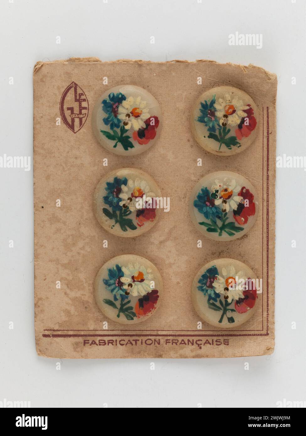 Galeries Lafayette. Plate of six tricolor flower buttons from Galeries ...