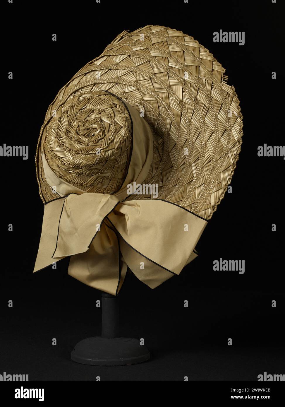 Large woven straw hat, with a raised asymmetrical pass and high ...