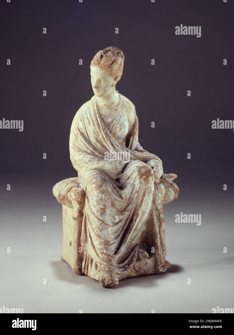 Anonymous. "Young woman sitting on a diphros". Molded terracotta, pale ...