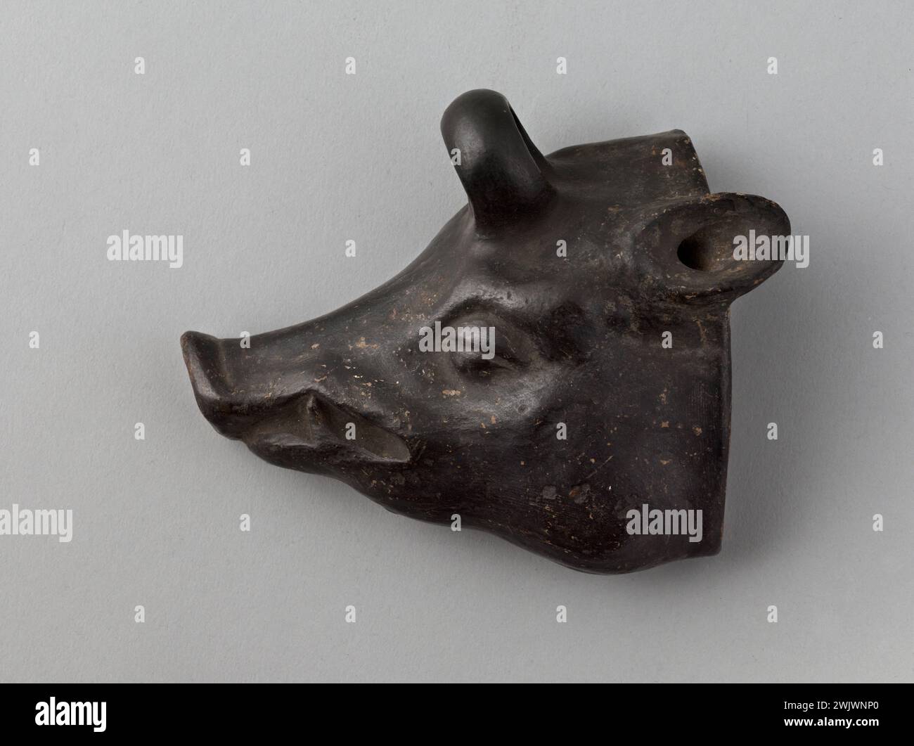 Guttus in the form of a half-tank of wild boar. Molded terracotta ...